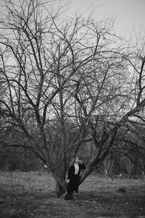 Free: Grayscale Photography of Woman Standing and Leaning on Bare Tree ...