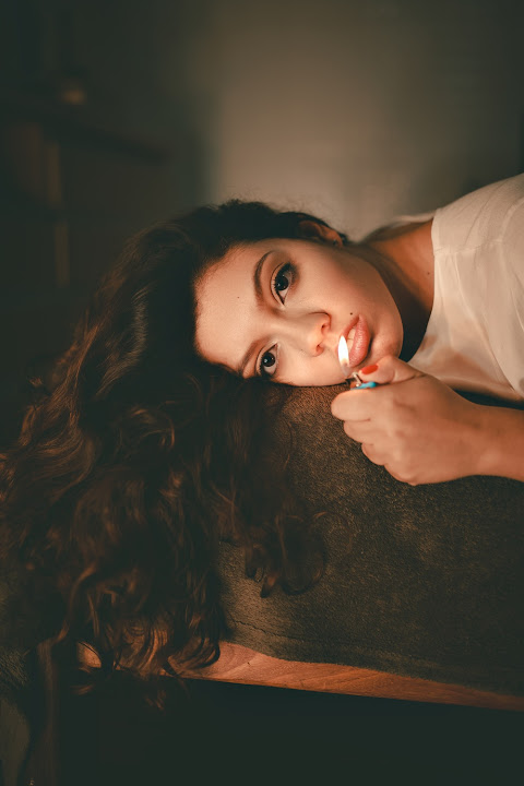 Free: Photo Of Woman Holding Lighter - nohat.cc