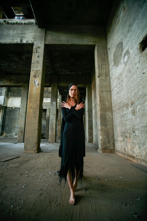 Free: Photo of Standing Woman in Black Dress Walking Barefooted in ...