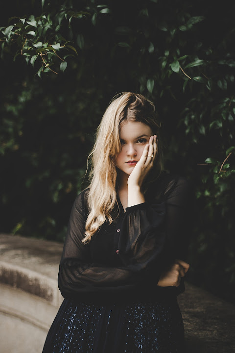Free: Woman Holding Left Cheek Photography - nohat.cc