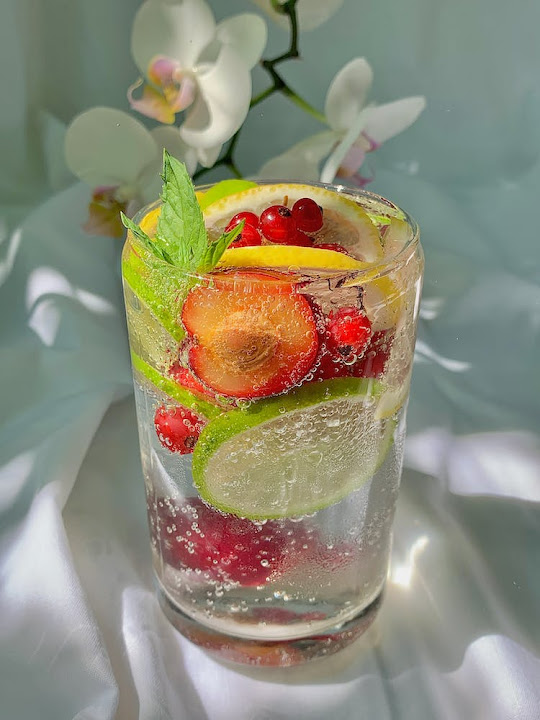 Free: A Glass of Bubbly Citrus Drink with Red Berries and Mint Leaves ...