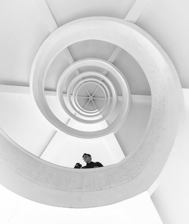 Free: Man Standing On Spiral Stairs - nohat.cc