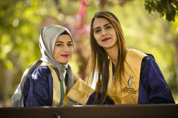 Free: Selective Focus Portrait Photo of Smiling Women in Academic ...